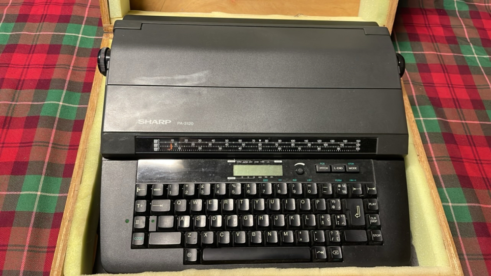 CASED SHARP TYPEWRITER
